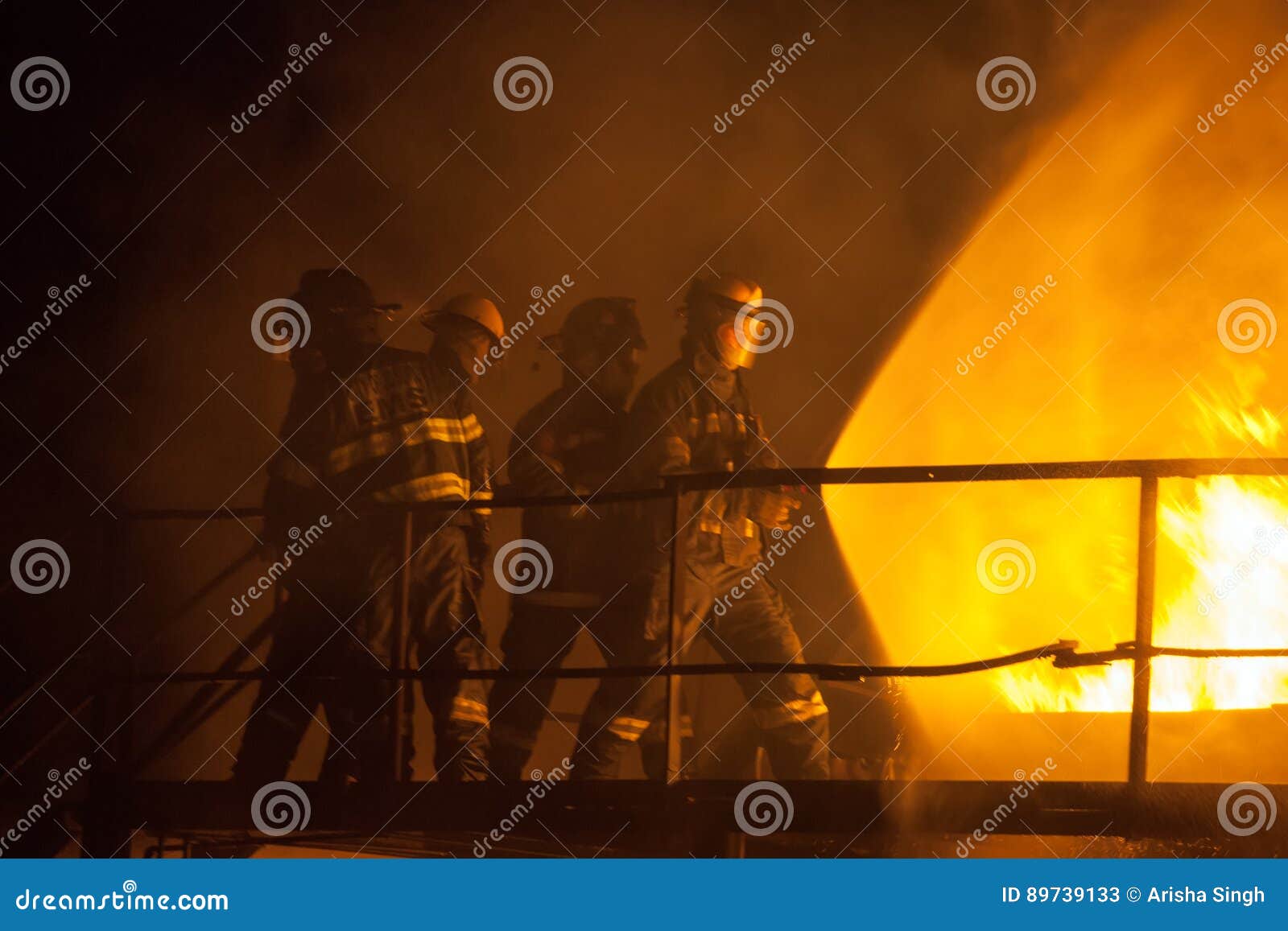 Firefighters Using Full Spray To Put Out a Fire during Firefighting ...