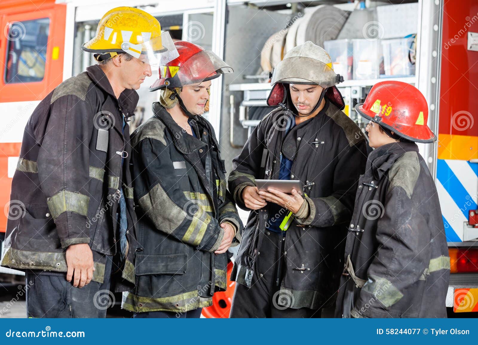 Firefighters Using Tablet Computer at Fire Station Stock Image - Image ...