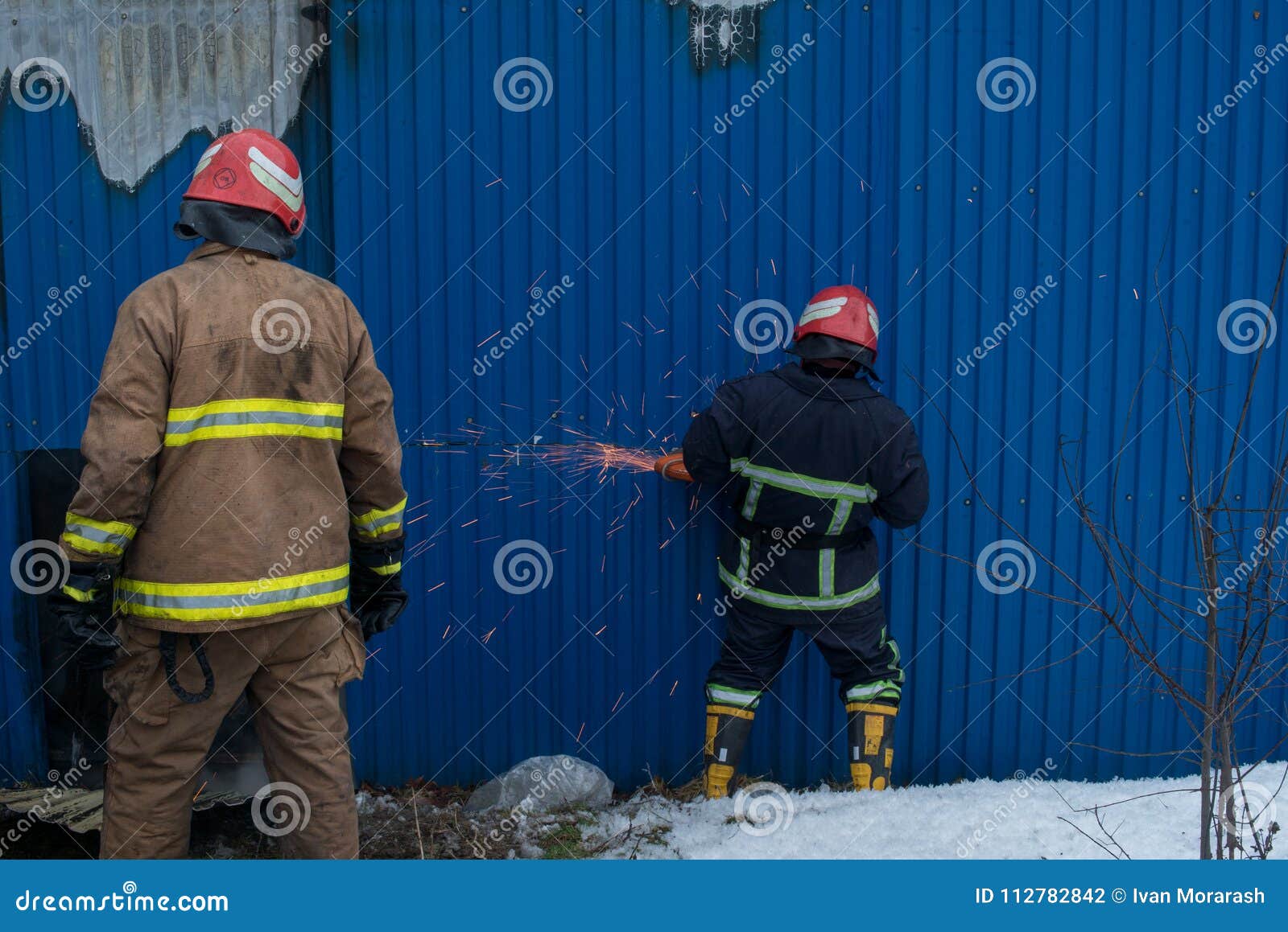 Firefighters Work on an Fire of Building Using a Metal Cutter Rescue ...