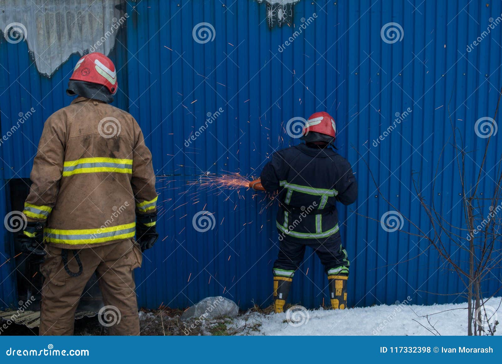 Firefighters Work on an Fire of Building Using a Metal Cutter Rescue ...