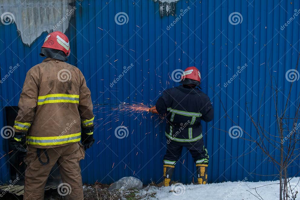 Firefighters Work on an Fire of Building Using a Metal Cutter Rescue ...