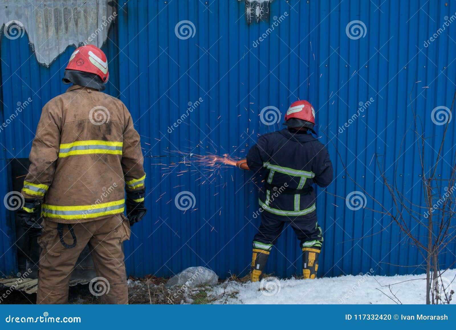 Firefighters Work on an Fire of Building Using a Metal Cutter Rescue ...