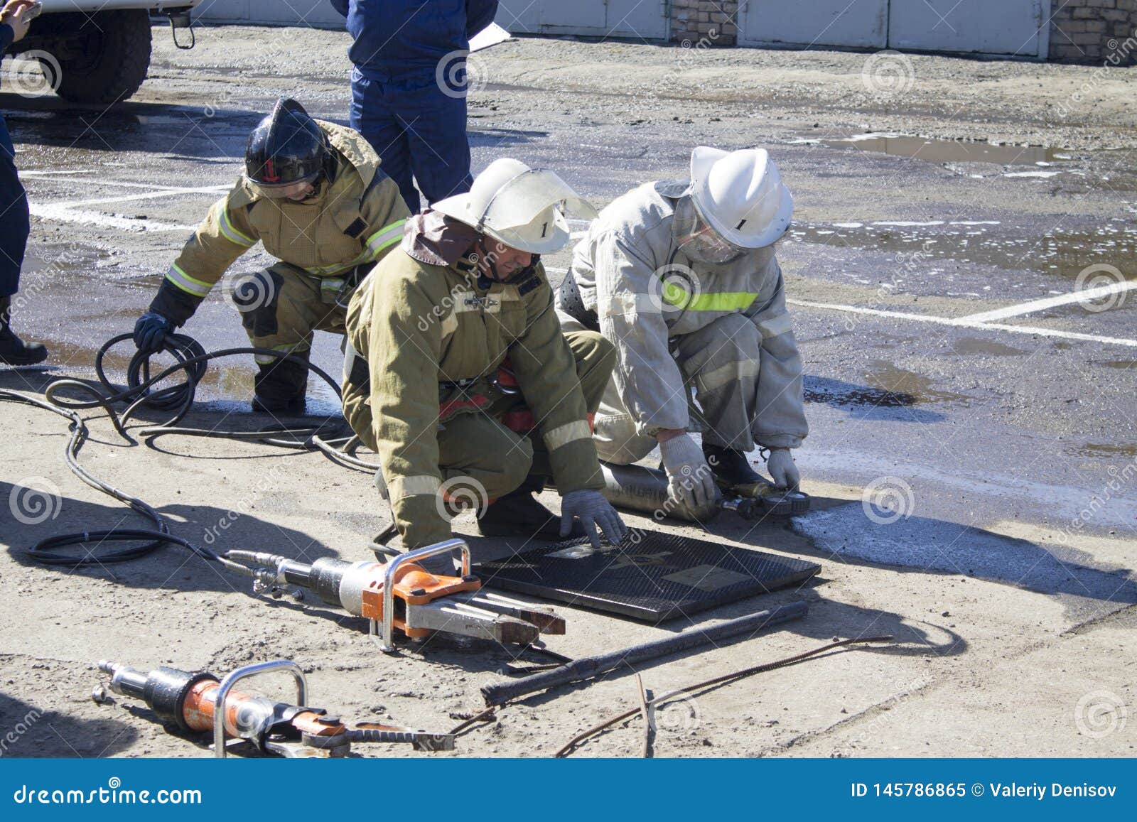 Firefighters at work. editorial image. Image of exercise - 145786865