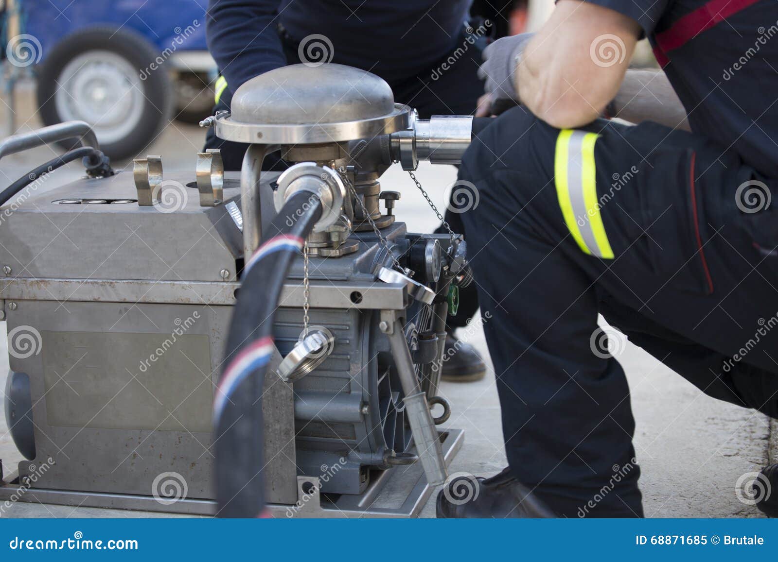 Firefighters Working with a Suction Pump Stock Image - Image of firemen ...