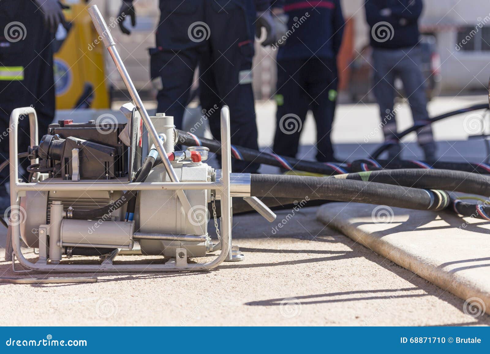 Firefighters Working with a Suction Pump Stock Photo - Image of ...