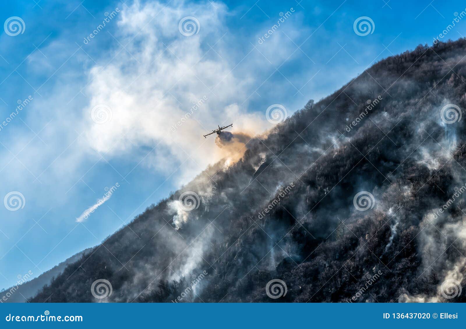 Firefighting Aircraft Dropping the Water for Fighting a Fire on ...