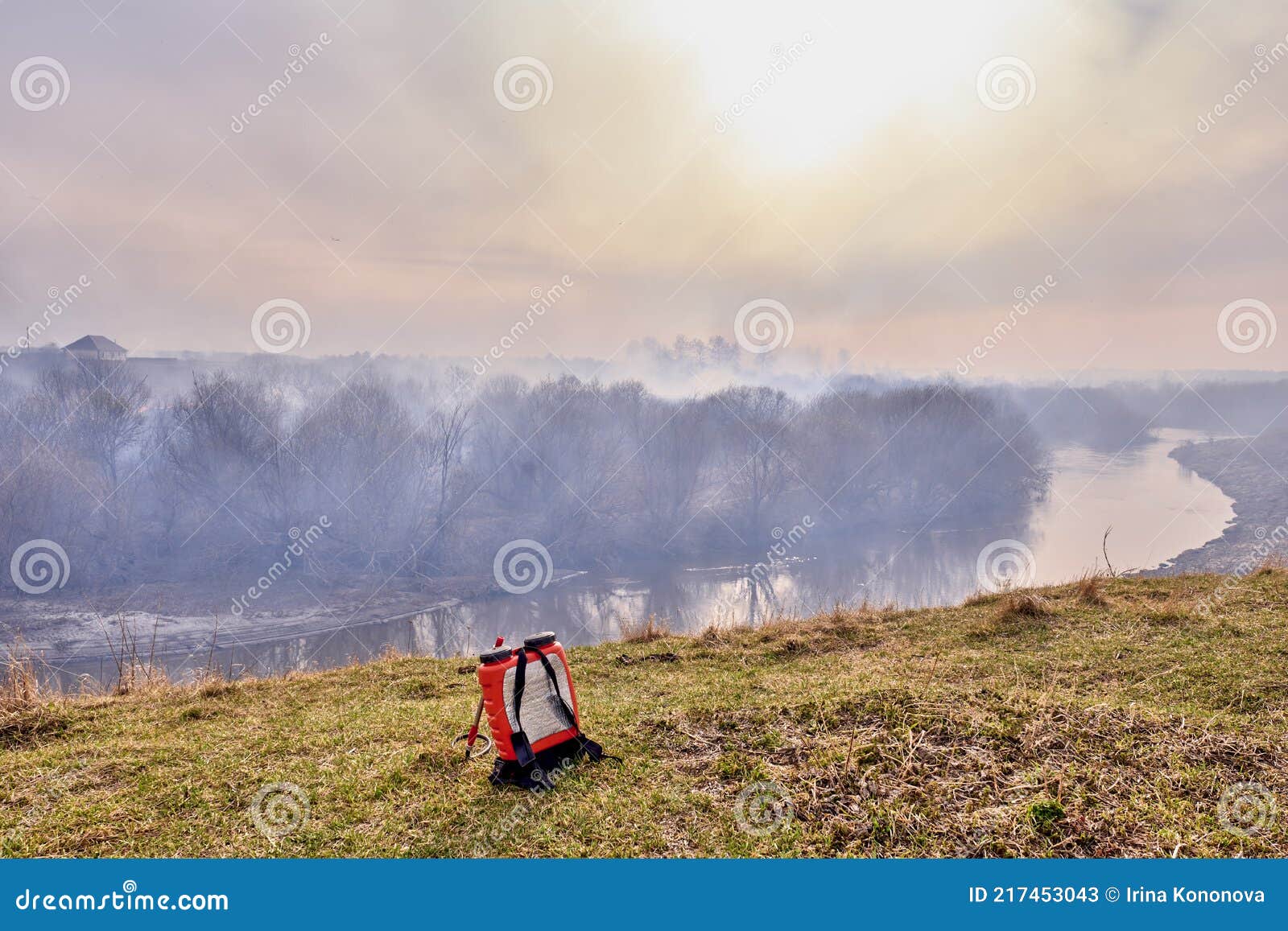 Firefighting Backpack on the Background of Grassroots Wildland Fire ...