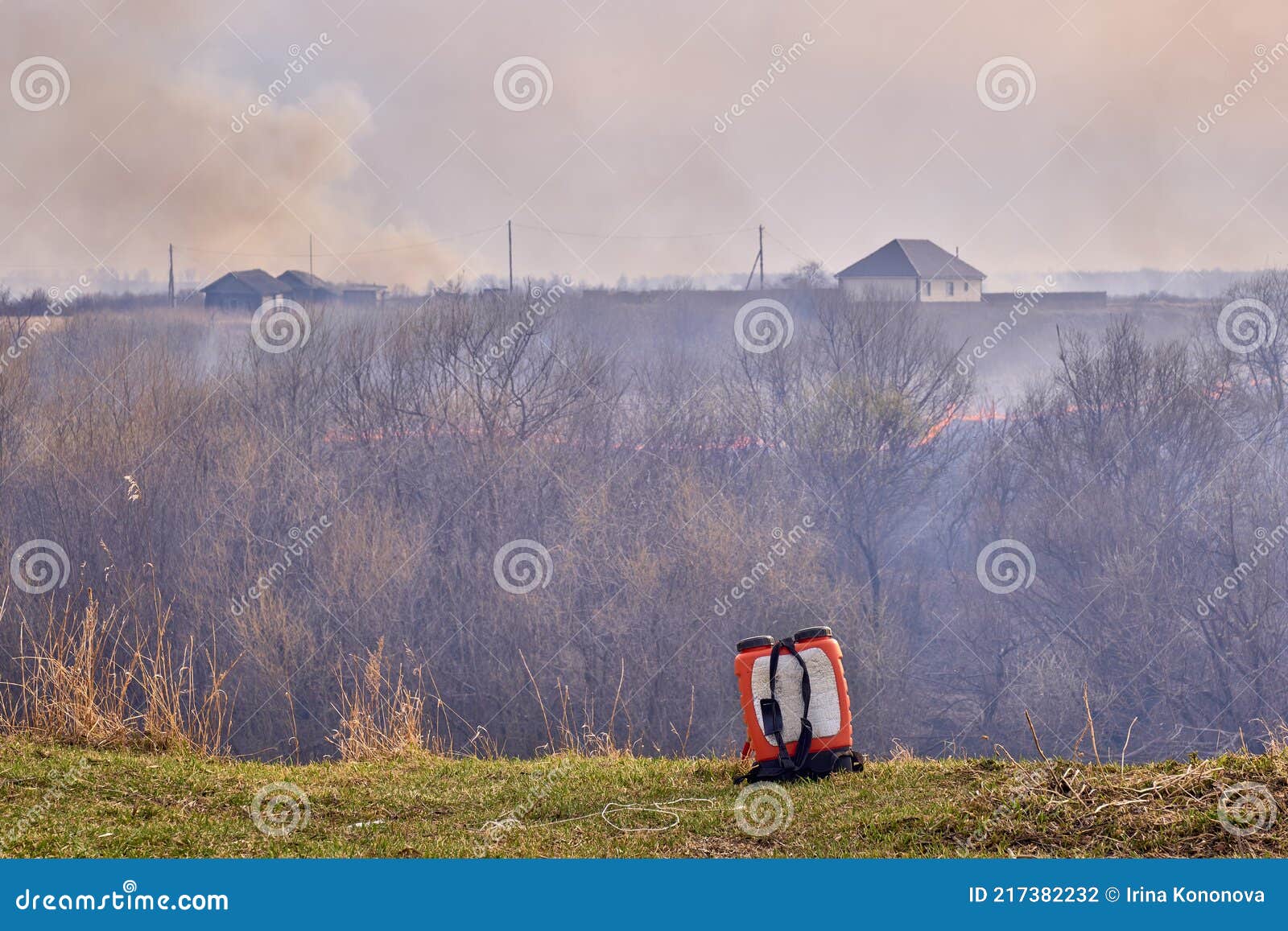 Firefighting Backpack on the Background of Grassroots Wildland Fire ...