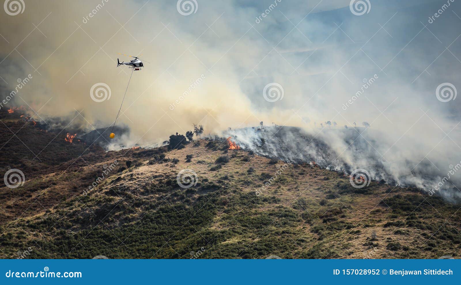 Firefighting Helicopter Drop Water on Forest Fire Stock Photo - Image ...