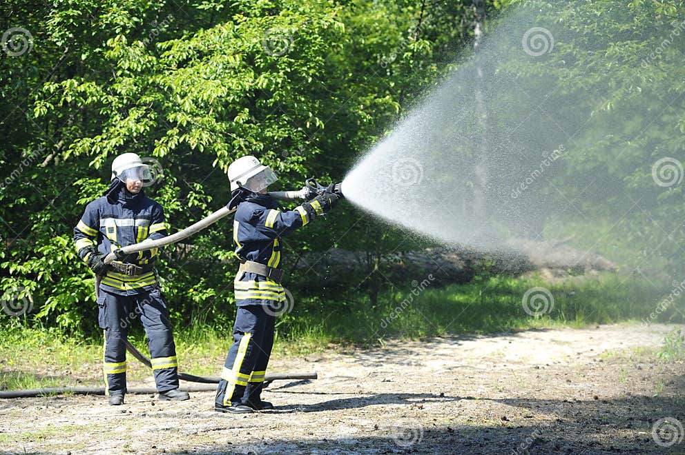Firefighting Team Training: Firemen in Protective Ensembles Fighting ...