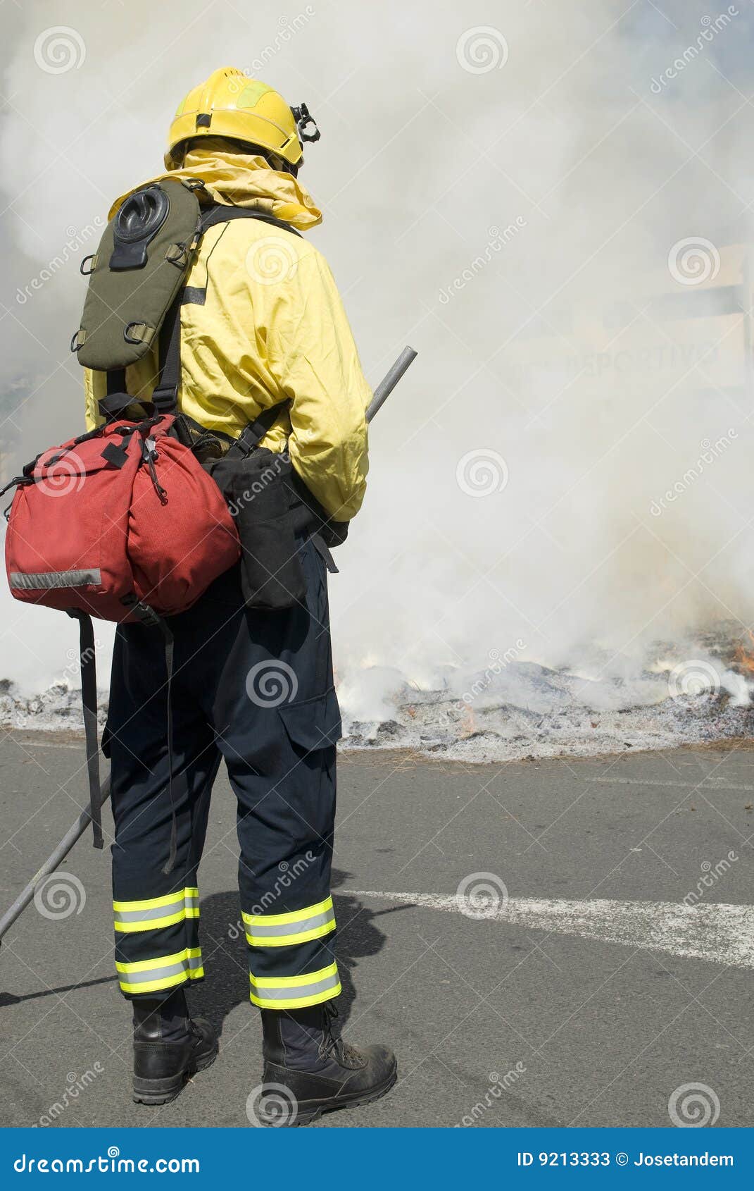 Fireman in a burning field stock image. Image of nature - 9213333