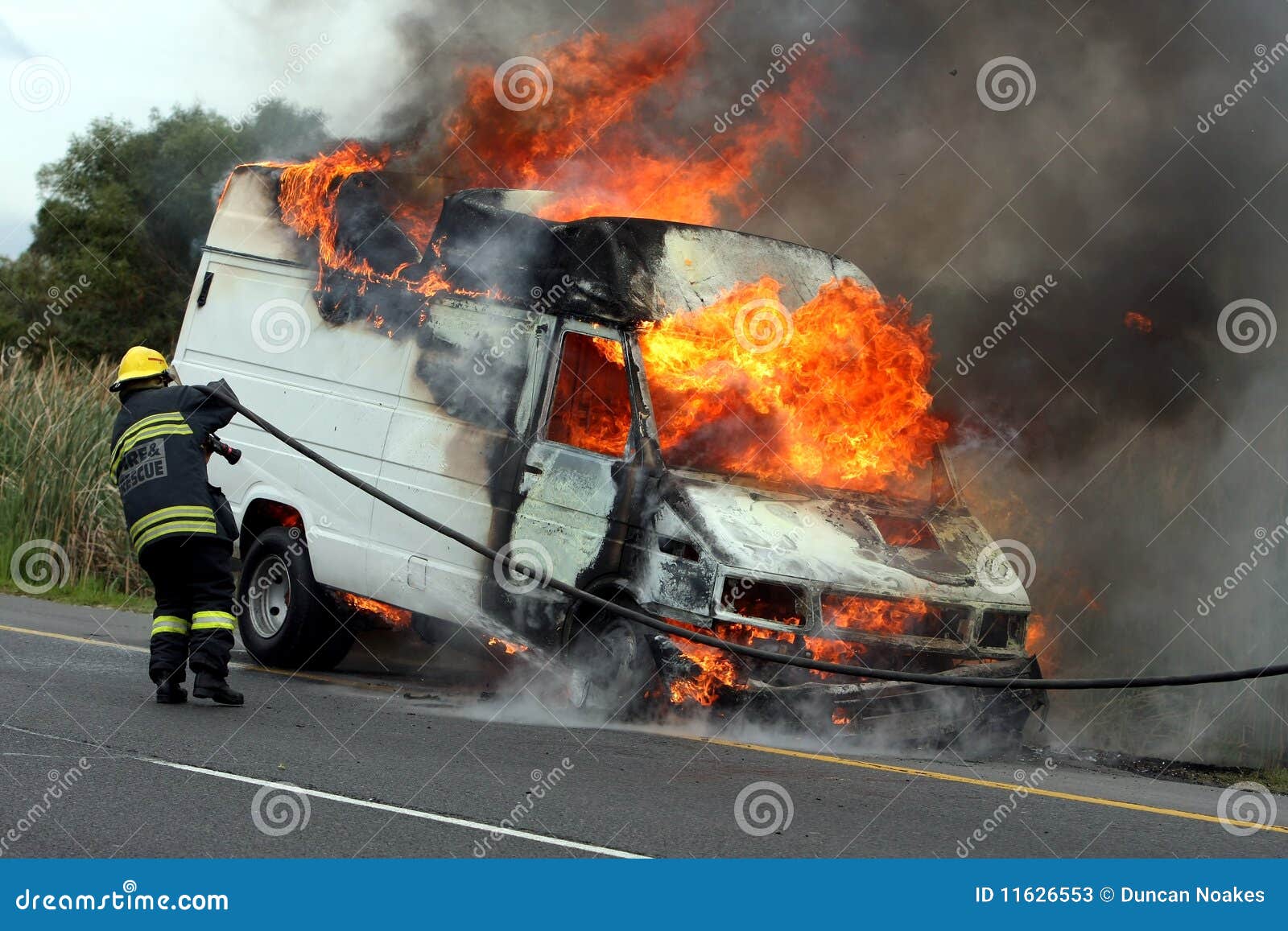 Fireman and Burning Motor Car Stock Image - Image of auto, outdoors ...