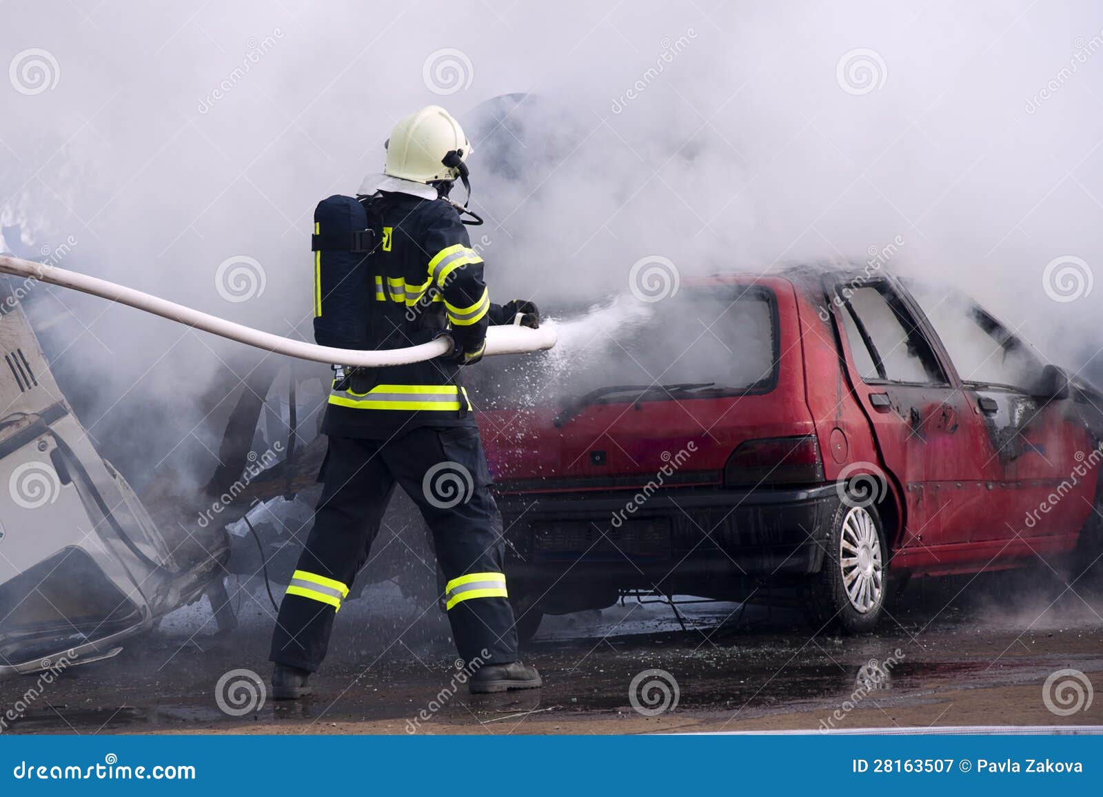 Fireman at car fire stock image. Image of professional - 28163507
