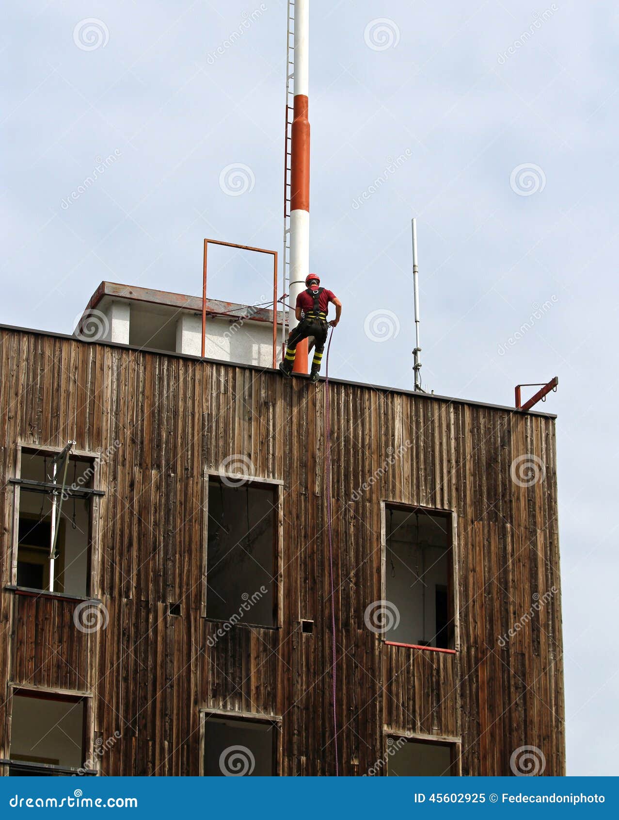 Fireman Climbing Expert during the Ascent Abseiling from a Build ...