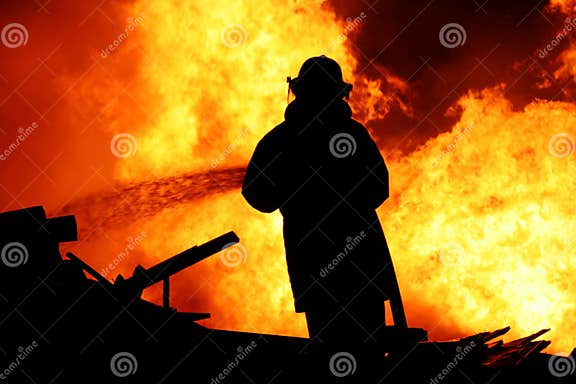 Fireman Controlling a Huge Fire Stock Image - Image of spraying, smoke ...