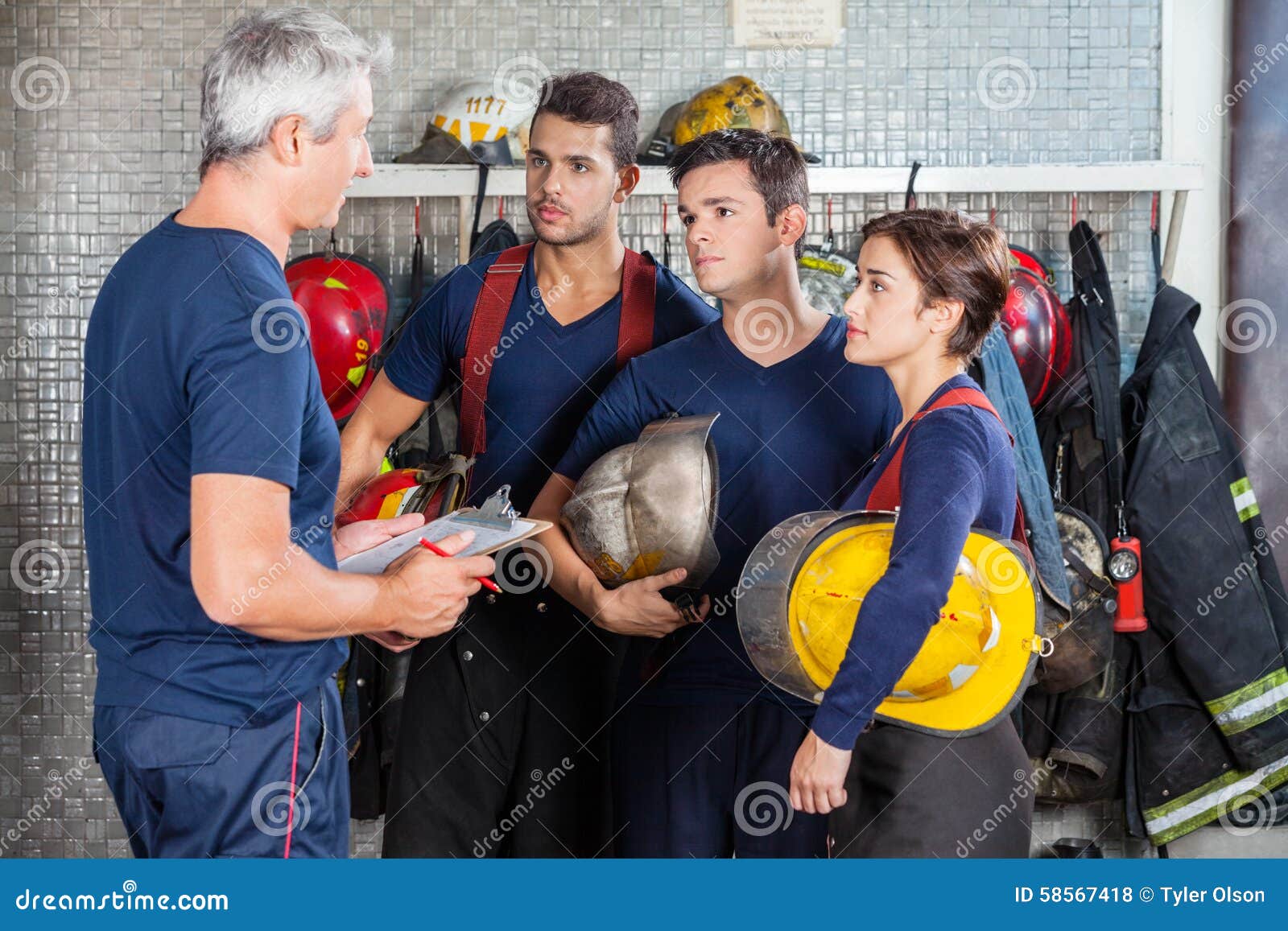 Fireman Discussing with Team Stock Photo - Image of fireman, checklist ...