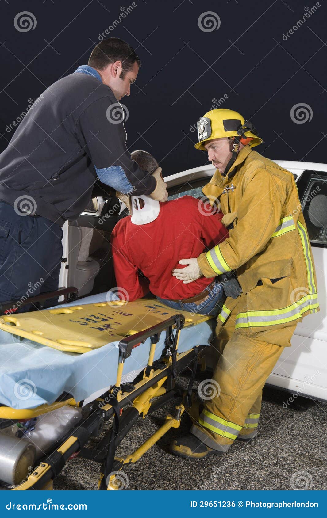 Fireman and Doctor Taking Out Victim from Car Stock Photo - Image of ...