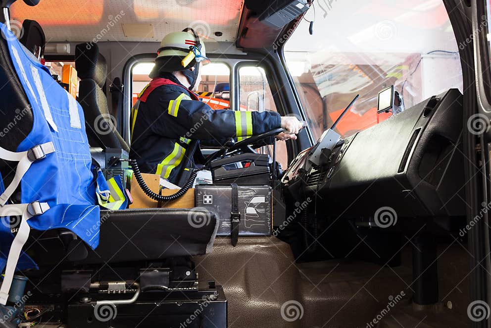 Fireman drive a fire truck stock photo. Image of mission - 51881184