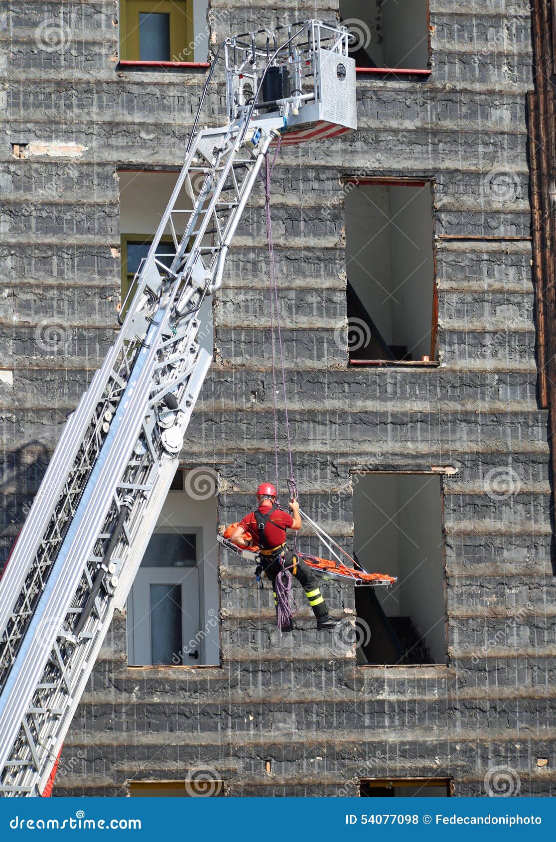 Fireman during an Exercise Carries the Stretcher with the Rope Stock ...
