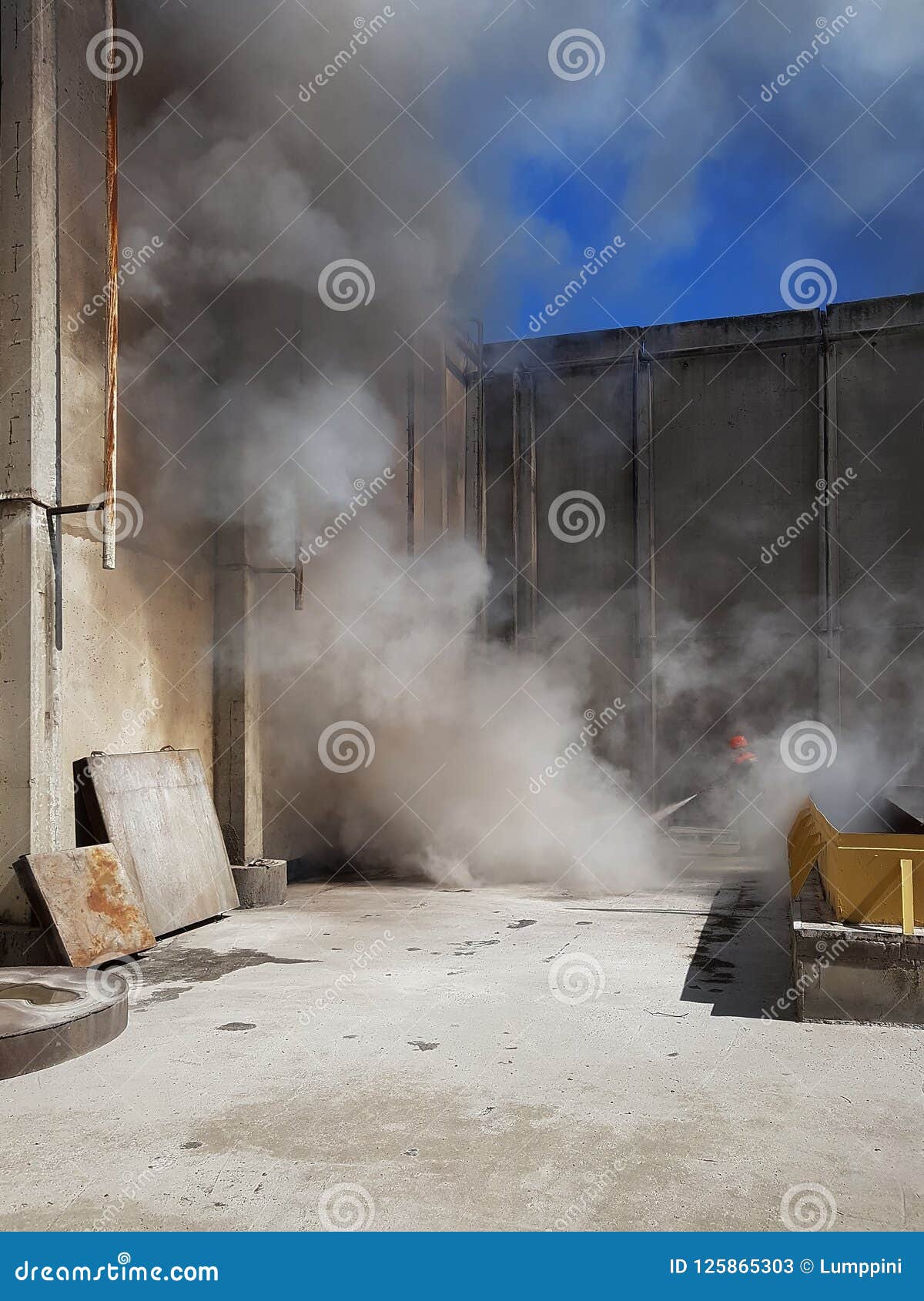 The Fireman Extinguishes the Fire with Smoke. Stock Image - Image of ...