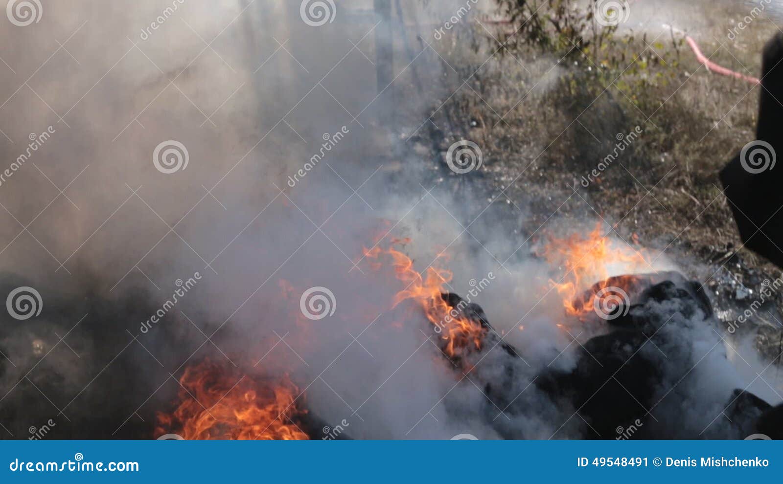 Fireman Extinguishes the Fire with a Water Jet Stock Video - Video of ...