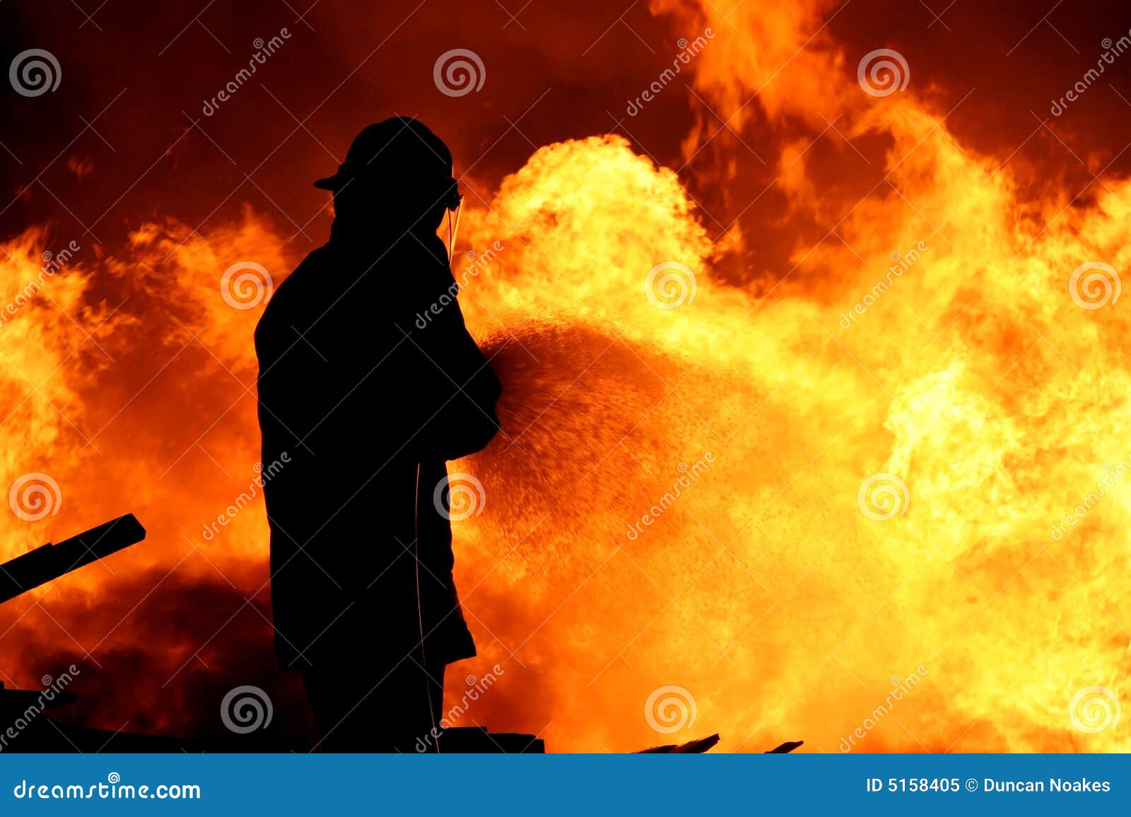 Fireman fighting a fire stock image. Image of visor, claim - 5158405