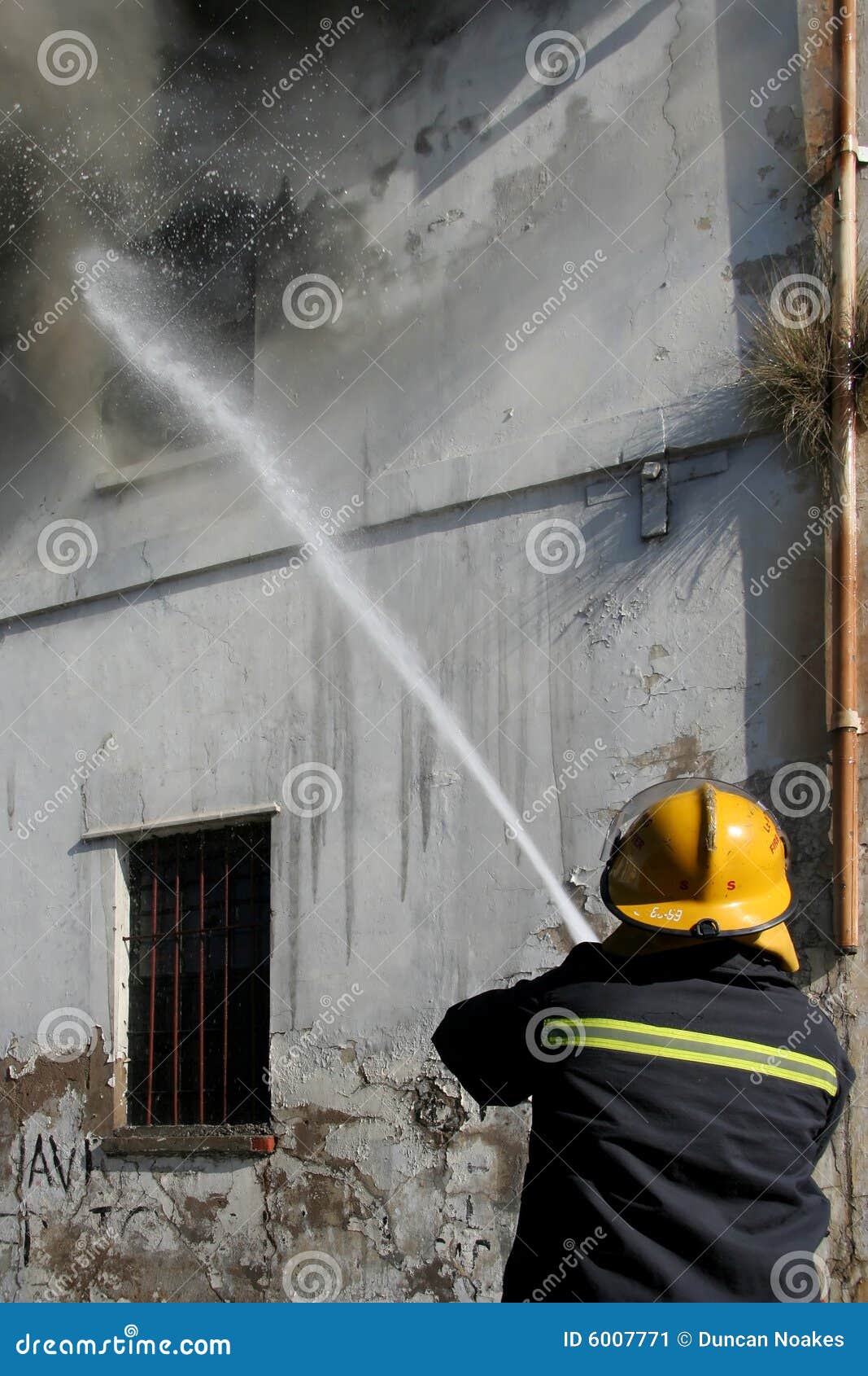 Fireman Fighting Fire stock image. Image of smoke, protective - 6007771