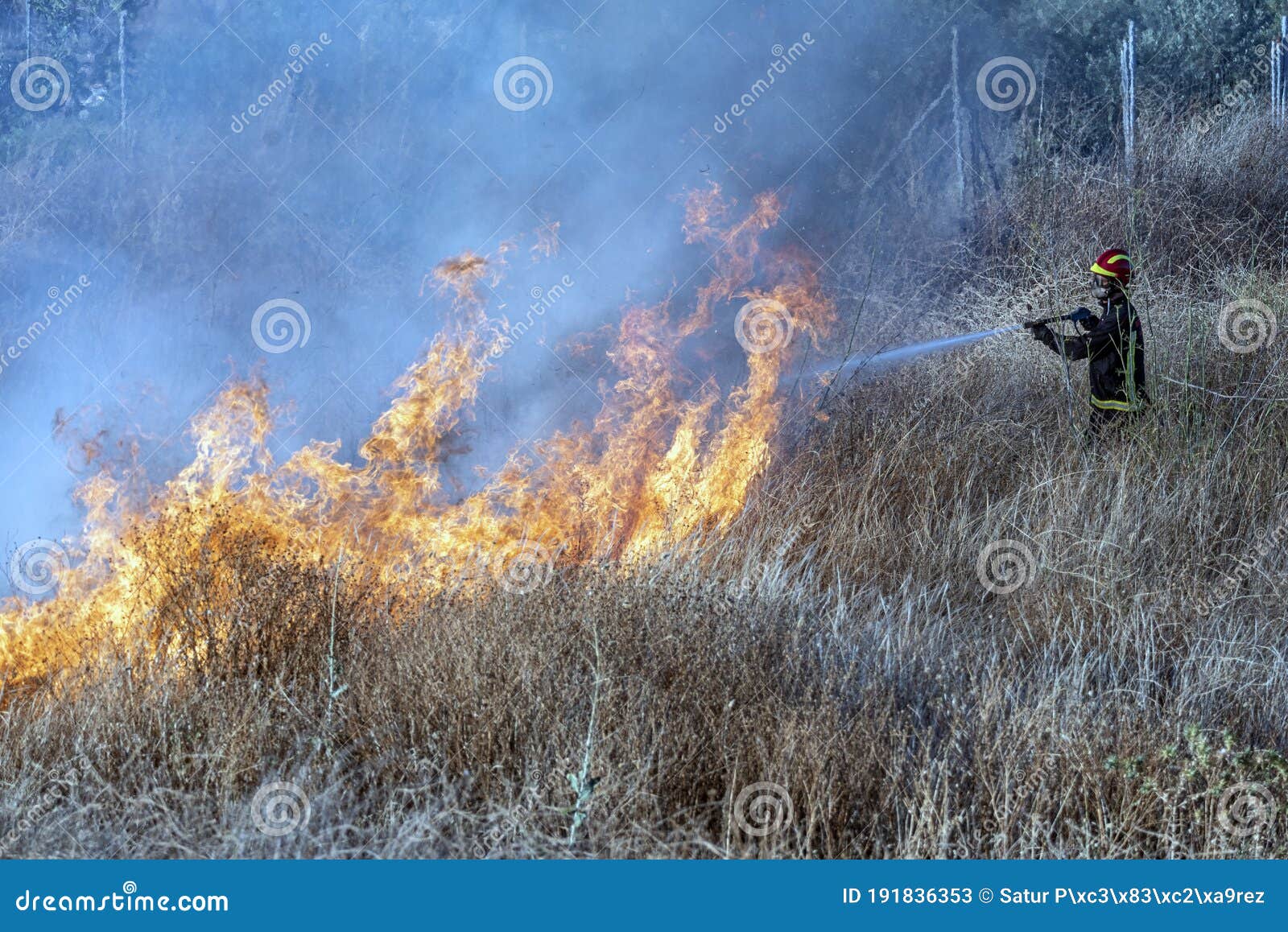 The Fireman Fighting His Greatest Enemy, Fire Stock Image - Image of ...