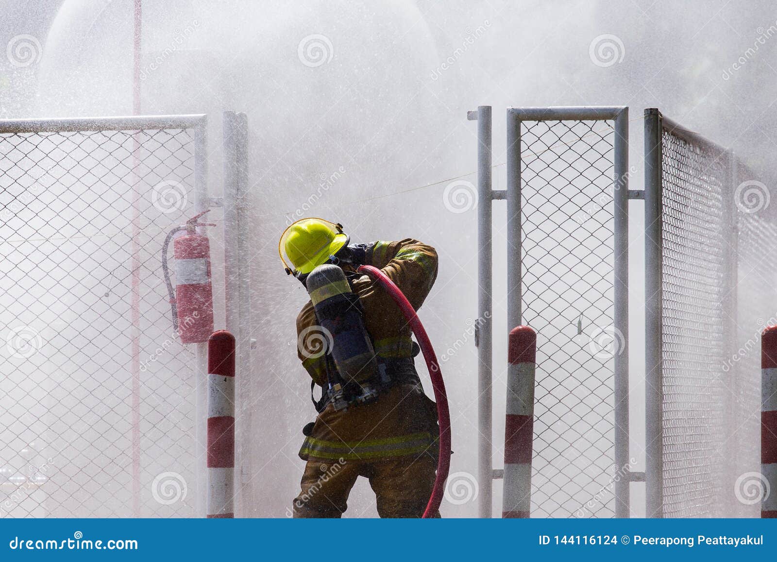 Fireman on the fire stock photo. Image of clothing, protective - 144116124