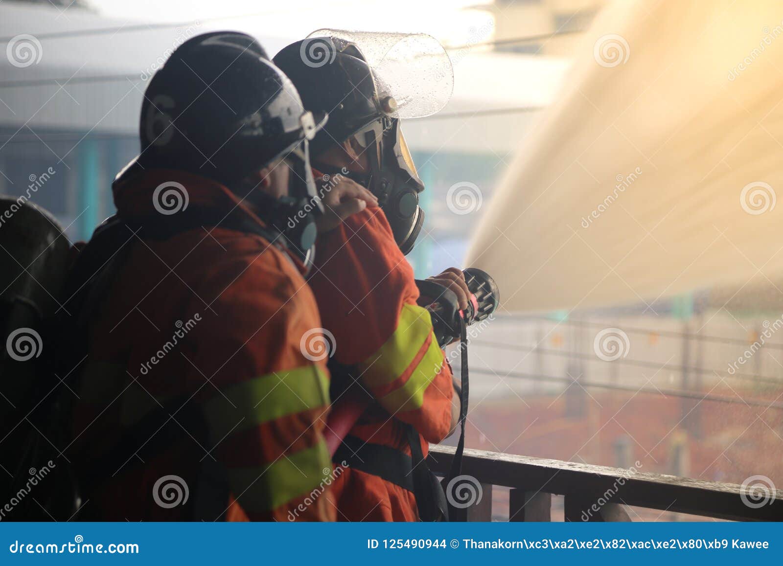 Firefighter in action stock photo. Image of damages - 125490944