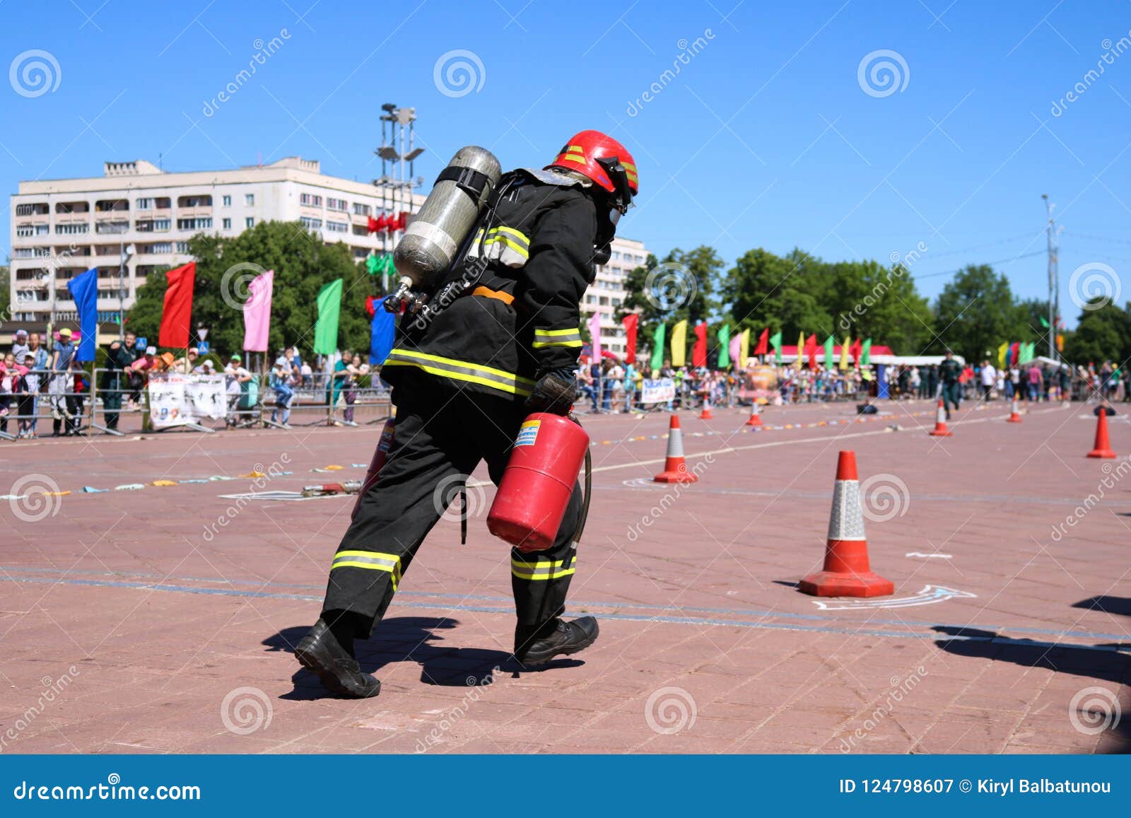 Fireman In Fireproof Uniform And Helmet Flexing His Biceps Royalty-Free ...