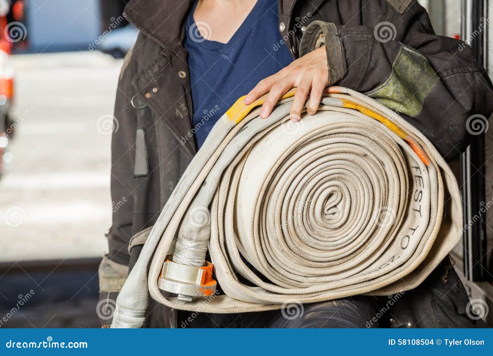 Fireman Holding Hose at Fire Station Stock Photo - Image of check ...