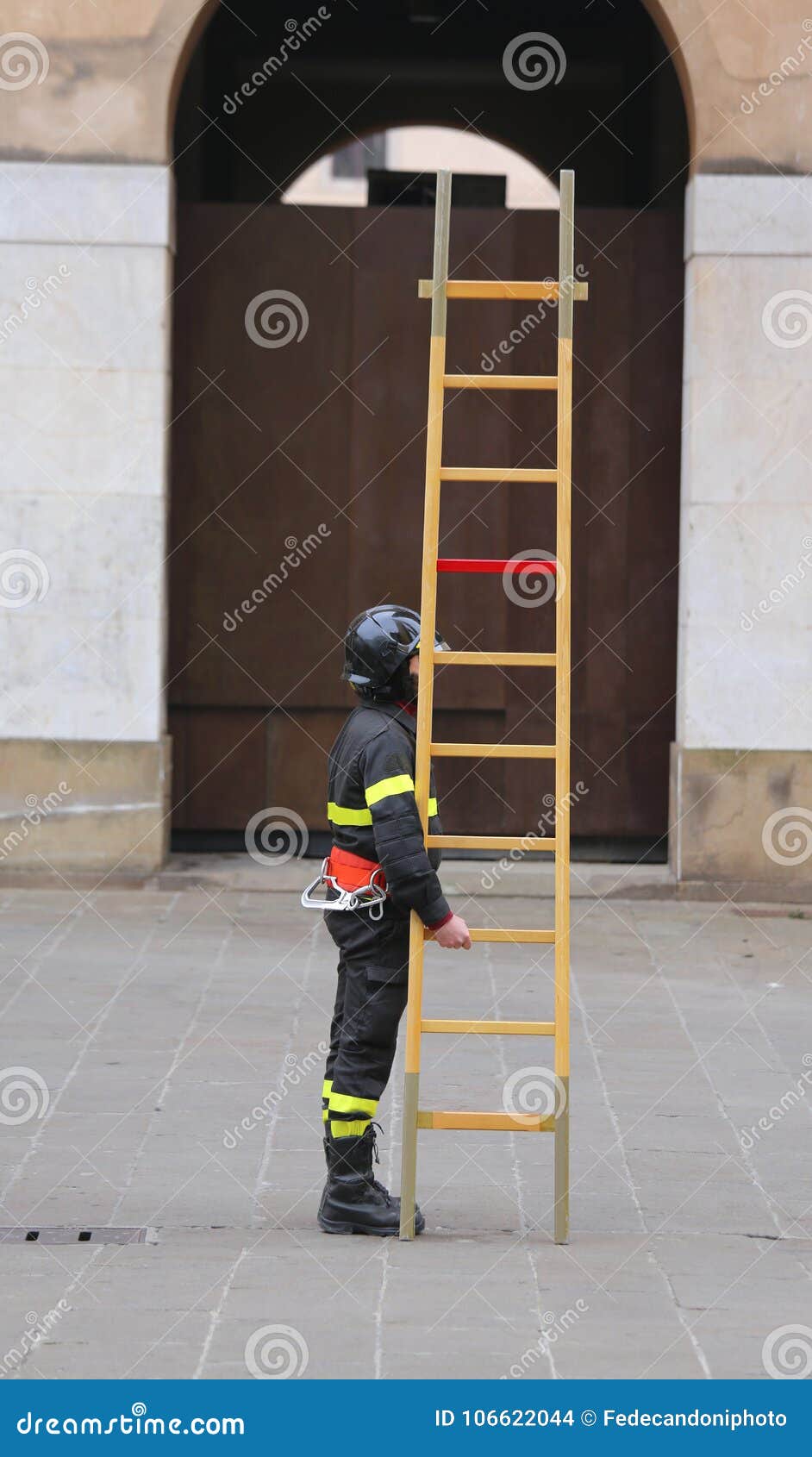 Fireman with wooden ladder editorial stock image. Image of practice ...