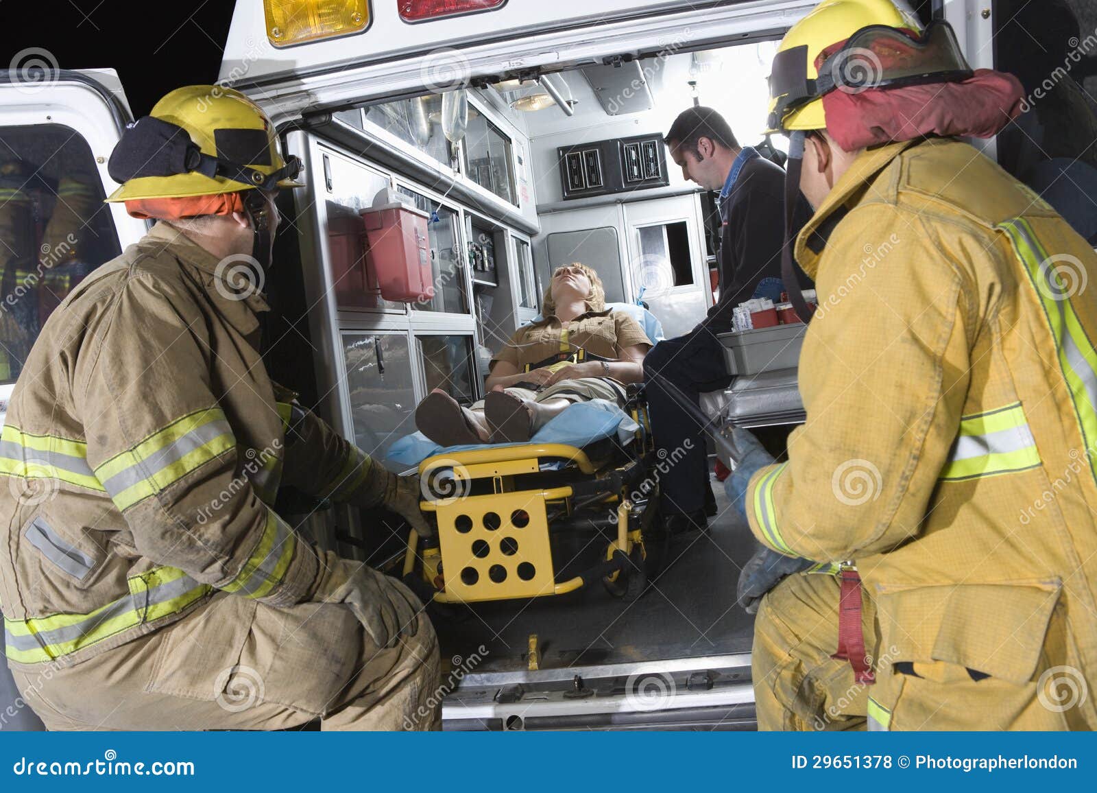 Fireman Looking at Patient and EMT Doctor Stock Photo - Image of ...