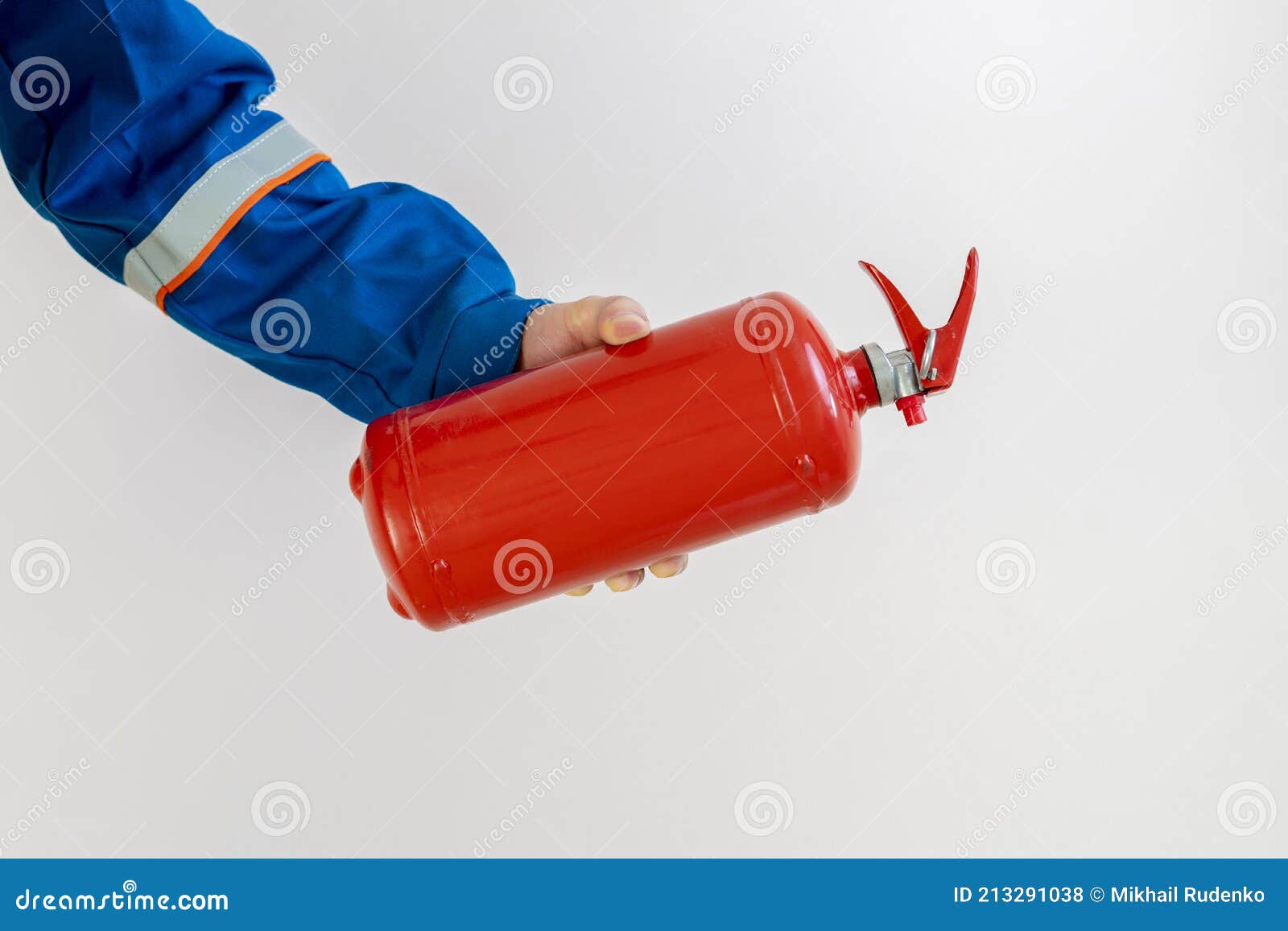 A Fireman Man Holding a Fire Extinguisher, Safe Work and Precautions ...