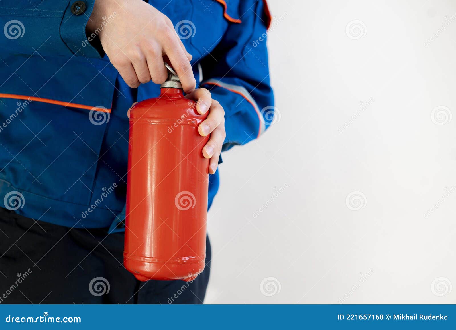 A Fireman Man Holding a Fire Extinguisher, Safe Work and Precautions ...