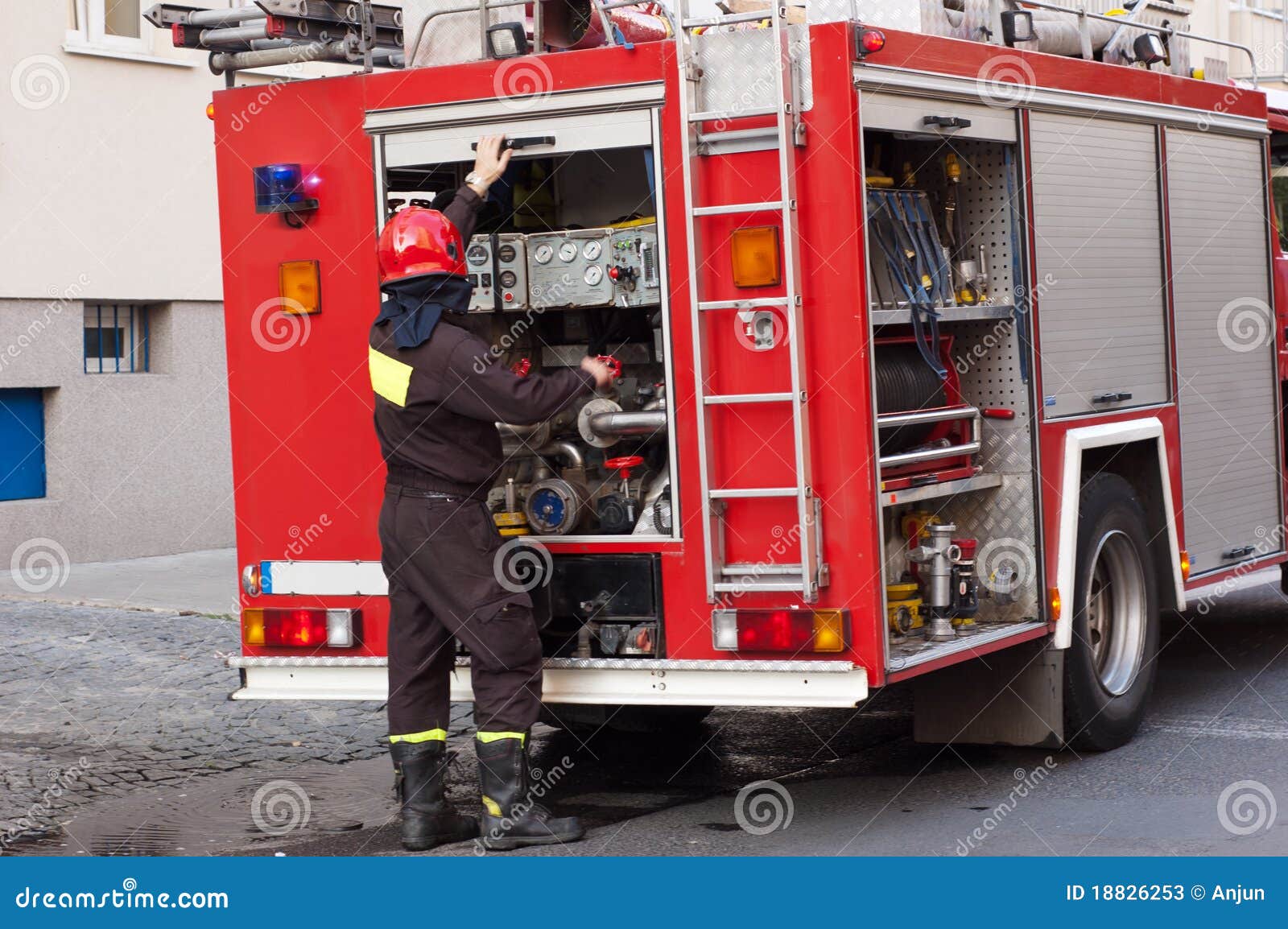Fireman near a fire engine stock image. Image of rescue - 18826253