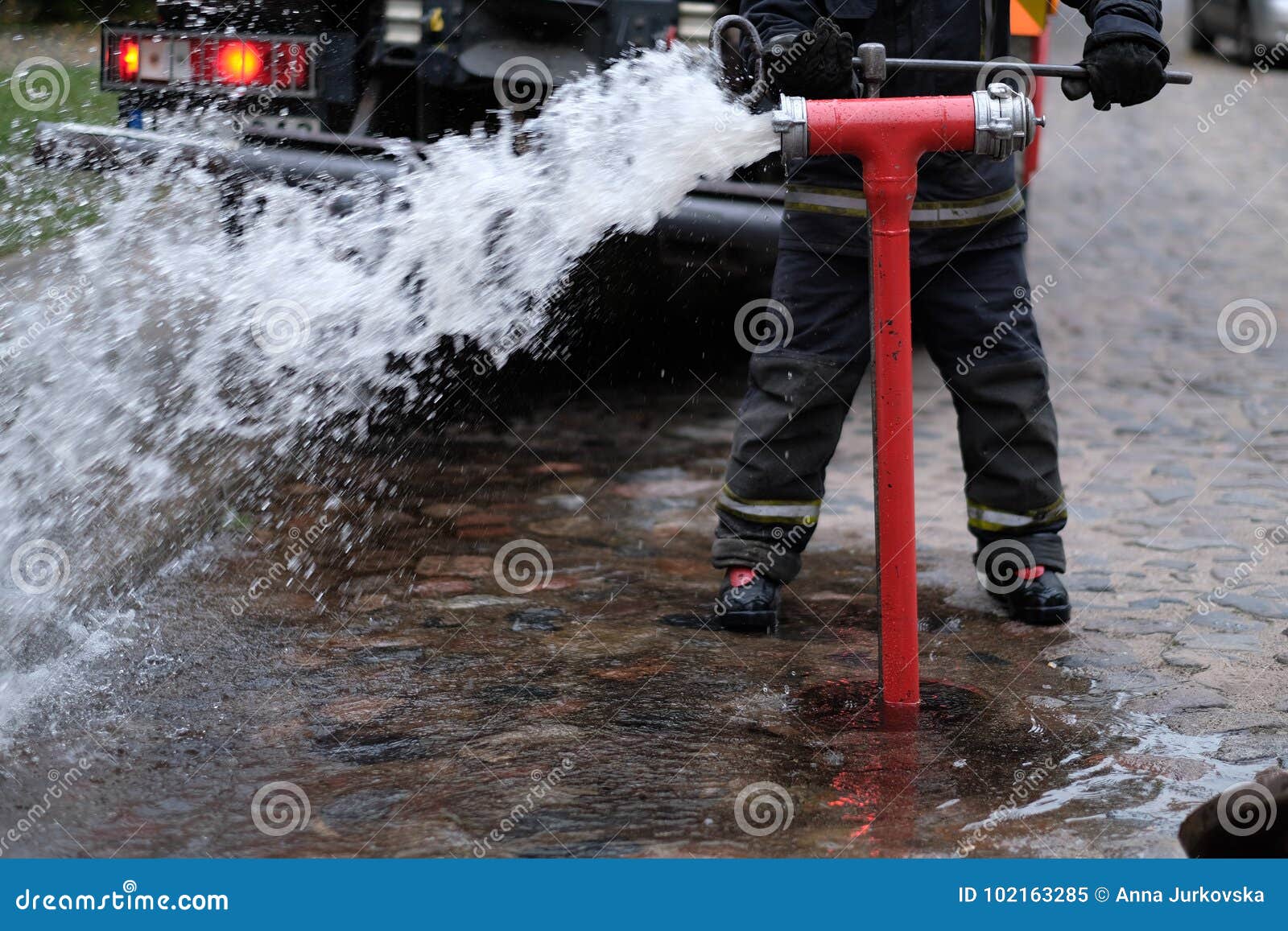 The Fireman Opens a Fire Hydrant Stock Image - Image of source ...