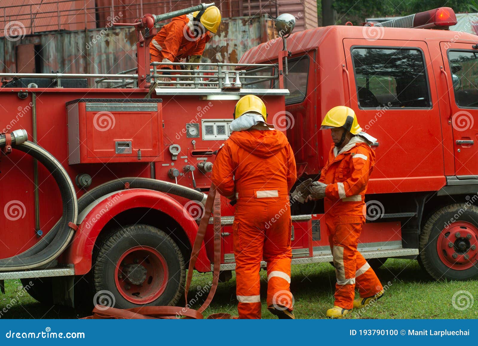 The Fireman is Preparing To Put Out the Fire at the Fire Engine ...