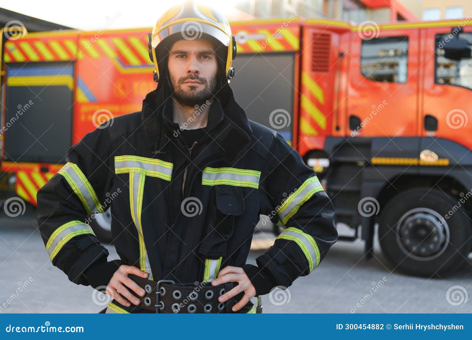 Fireman in Protective Uniform Standing Near Fire Engine on Station ...