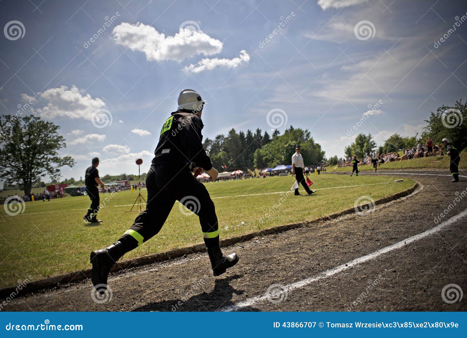 Fireman during race editorial photography. Image of green - 43866707