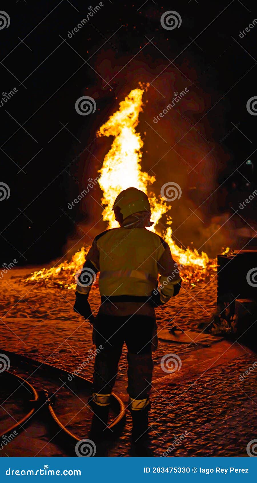 Fireman Saving a Fire with the Hose on the Ground Stock Photo - Image ...