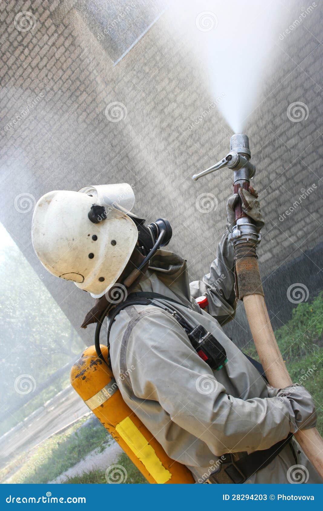 Fireman spraying water stock image. Image of protection - 28294203