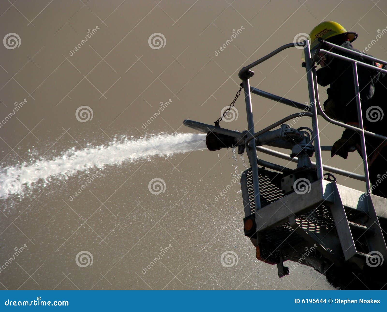 Fireman spraying water stock photo. Image of brigade, firefighter - 6195644