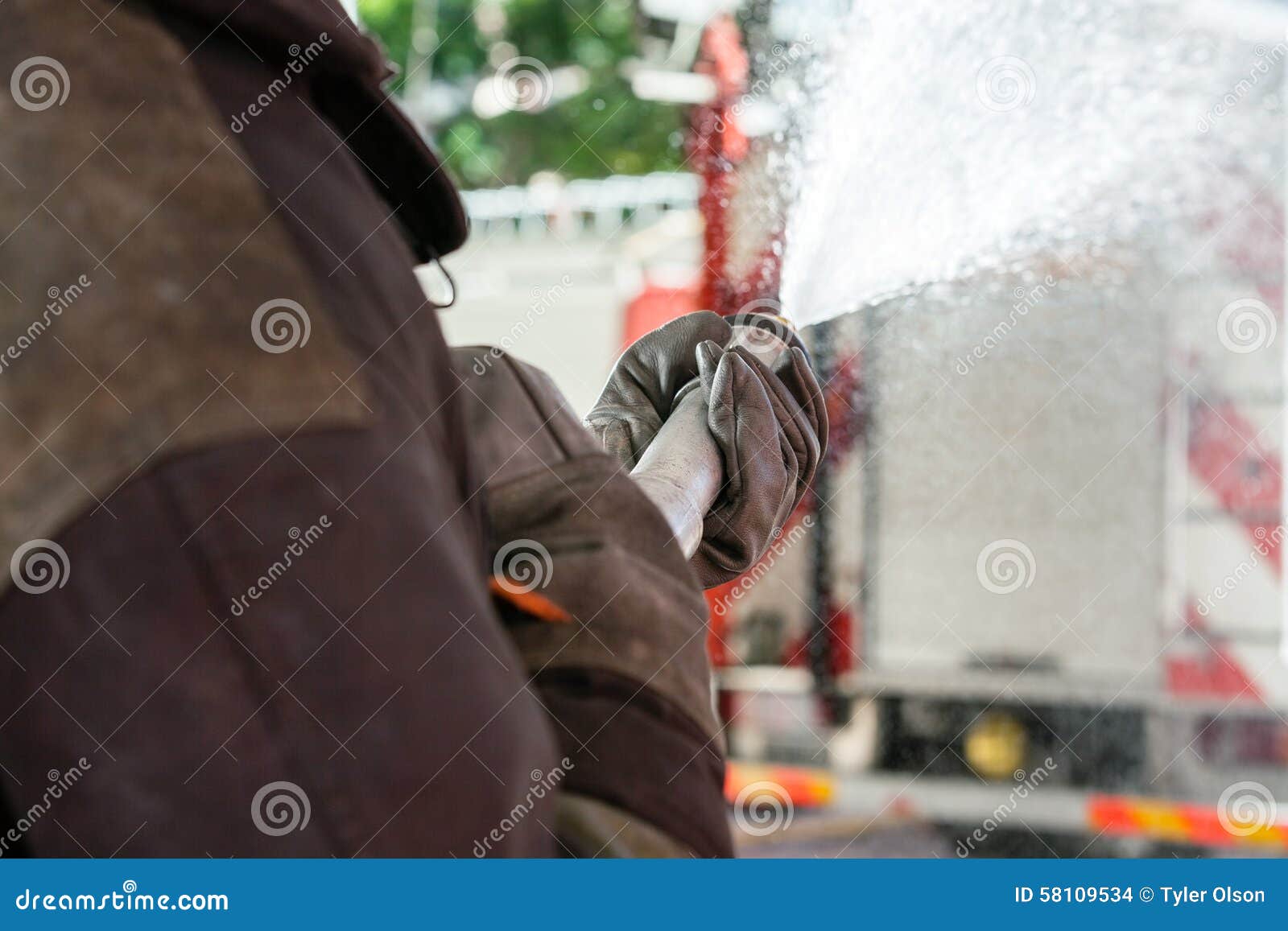 Fireman Spraying Water during Practice Stock Photo - Image of fireman ...