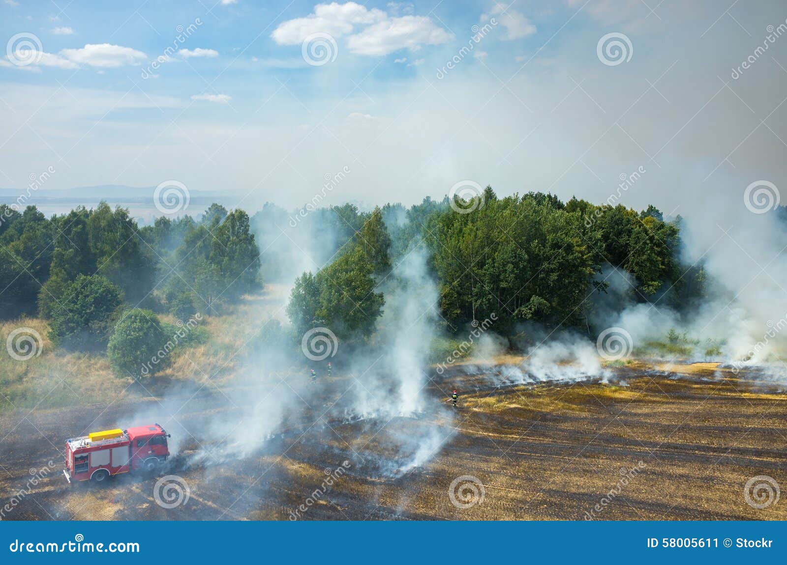 Fireman Truck Working on the Field on Fire Stock Image - Image of light ...