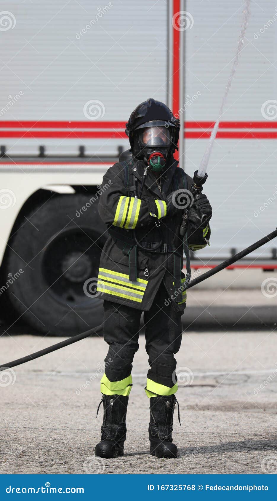 Fireman Uses a Fire Extinguisher To Extinguish a Fire Editorial Stock ...