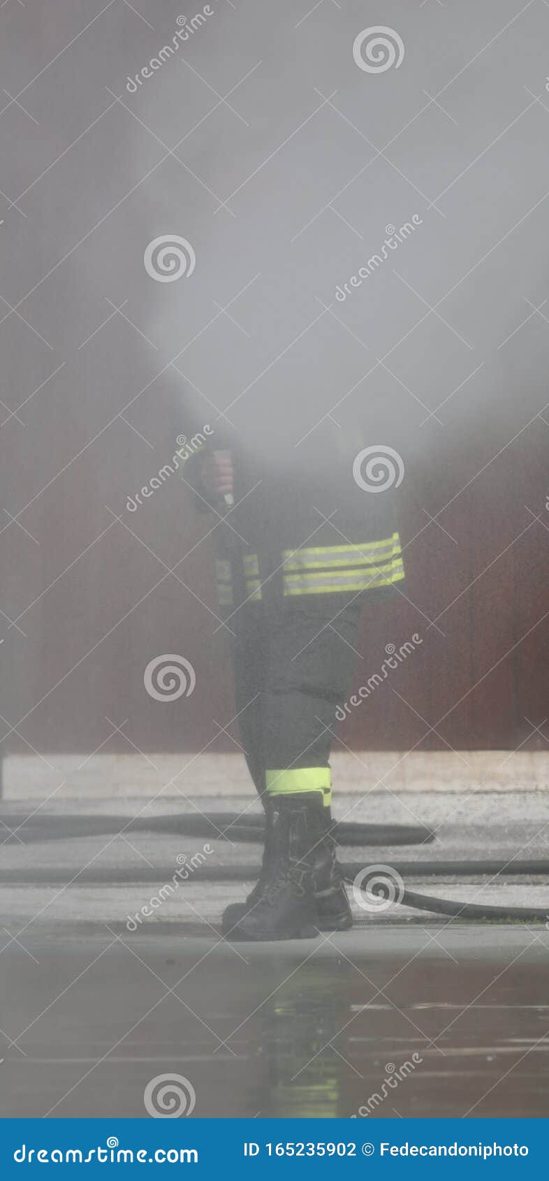 Fireman Uses a Fire Hydrant To Put Out a Fire Stock Photo - Image of ...