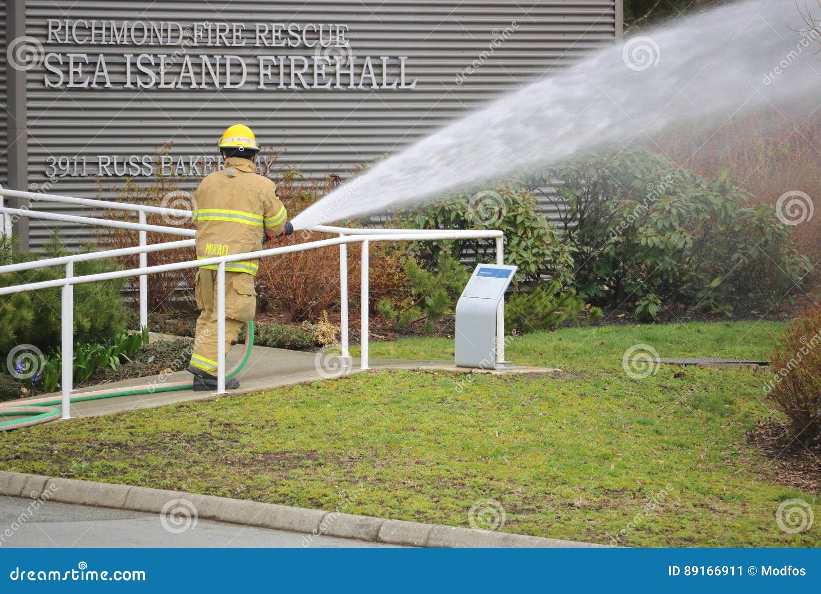 Fireman Using Fire Hose editorial photo. Image of routinely - 89166911