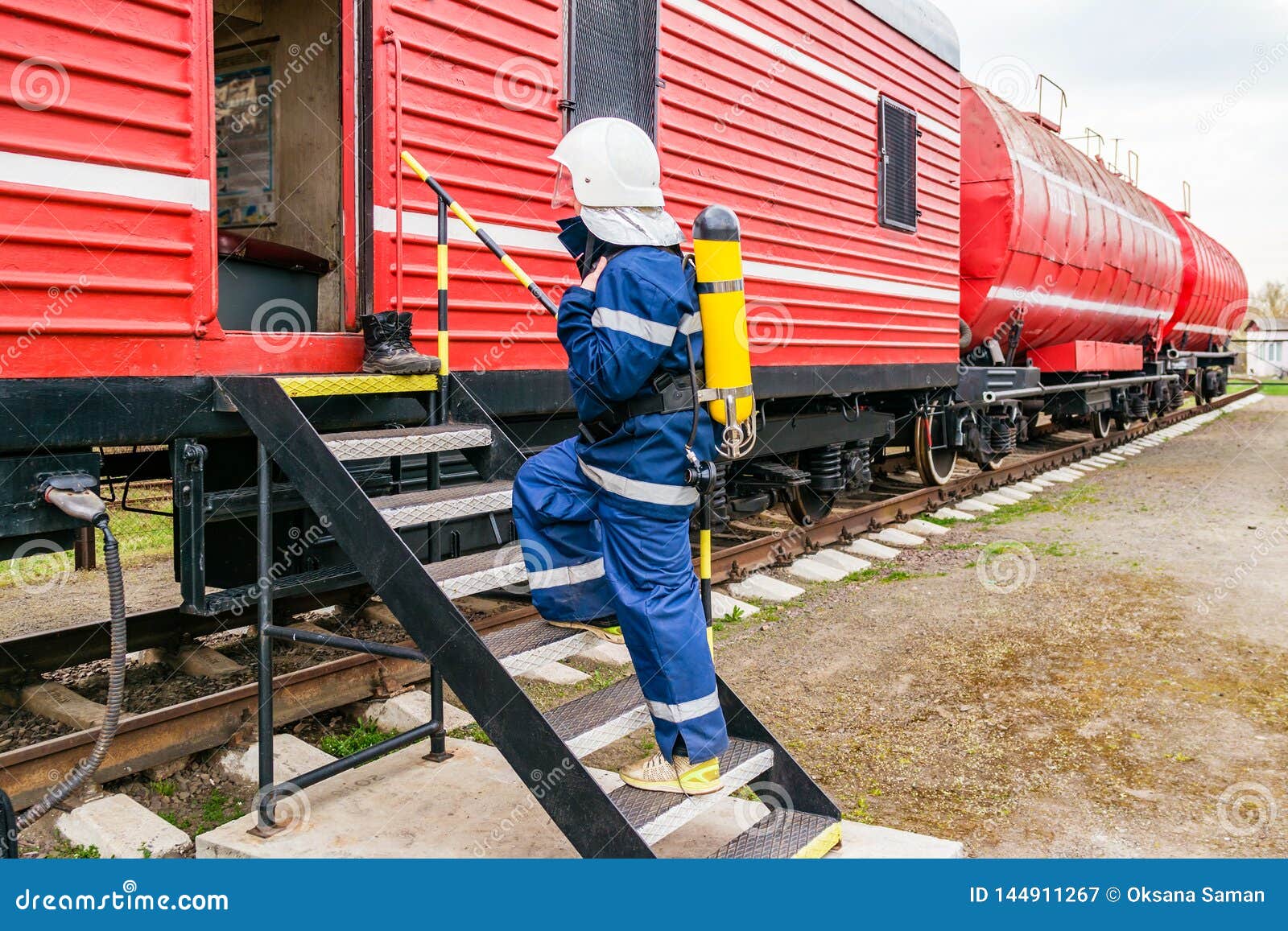 Fireman Wearing Protective Uniform Standing Next To a Fire Train Stock ...